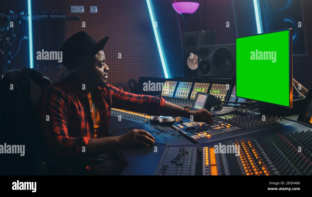 Stylish Audio Engineer Producer Working in Music Record Studio, Uses ...