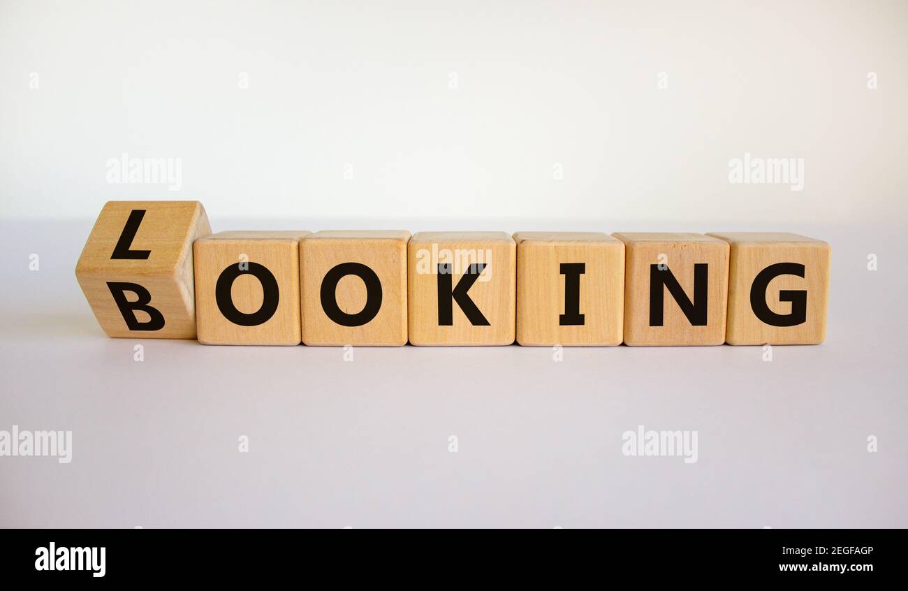 Looking and booking symbol. Turned the wooden cube and changed the word ...
