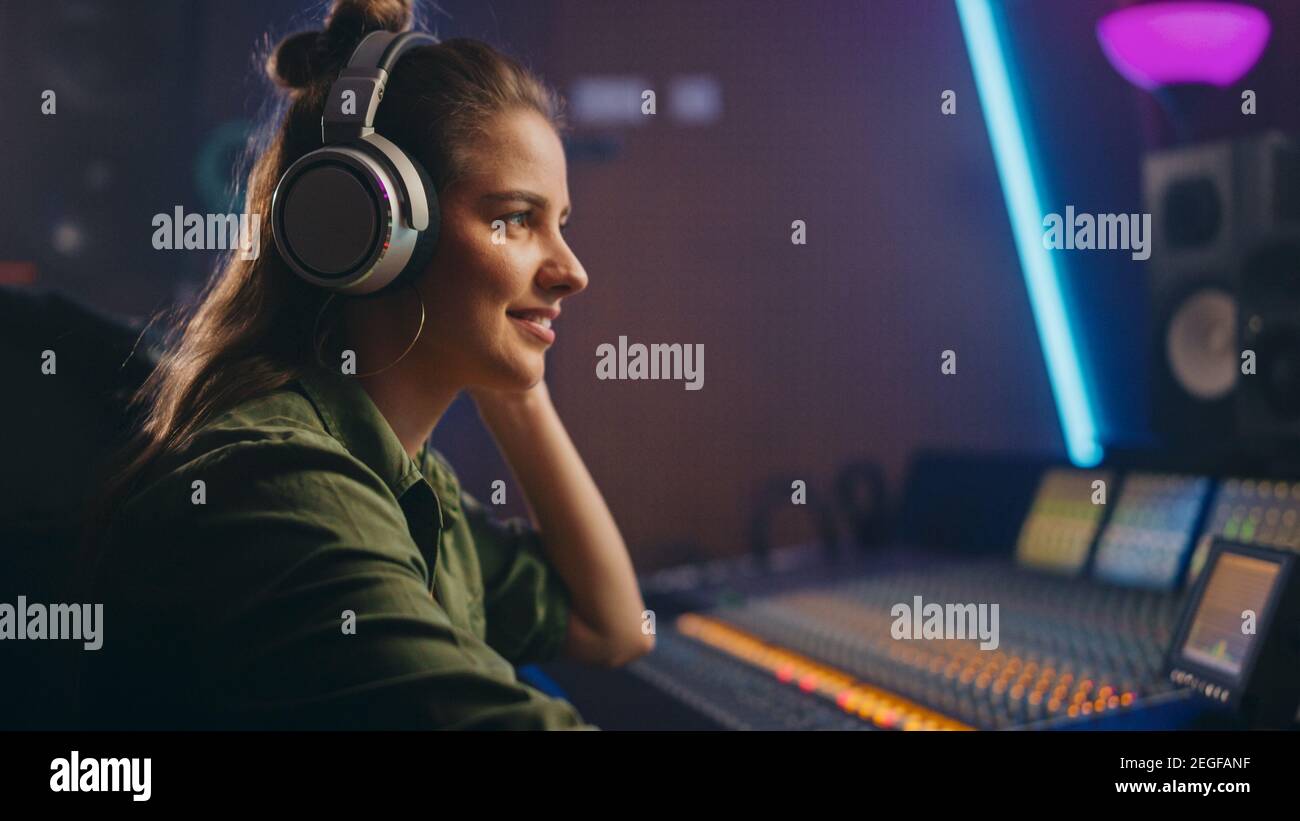 Stylish Female Audio Engineer Producer Working in Music Record Studio ...