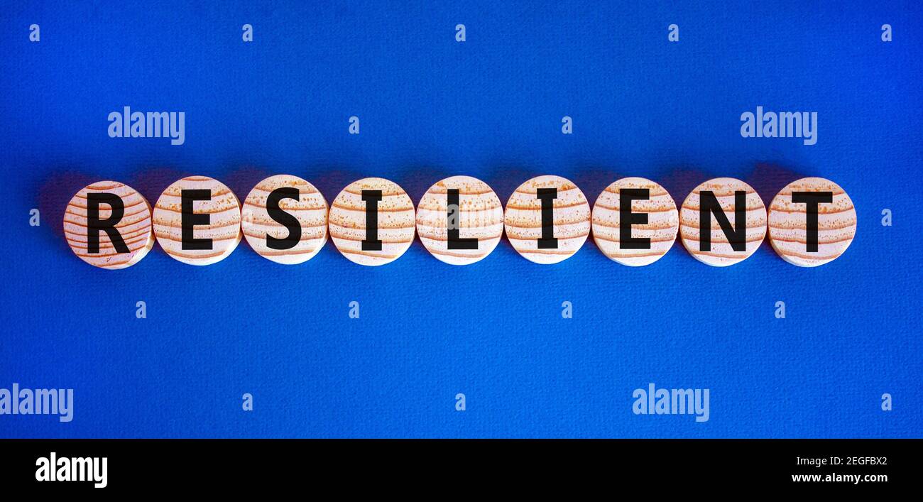Resilient symbol. Wooden circles with the word 'resilient'. Beautiful ...