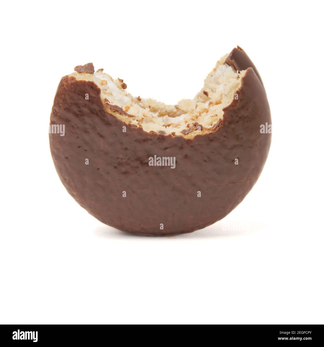 A piece of chocolate cake chokopie bitten off isolated on a white ...