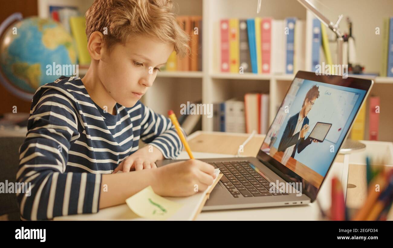 Smart Little Boy Uses Laptop for Video Call with His Teacher. Screen ...