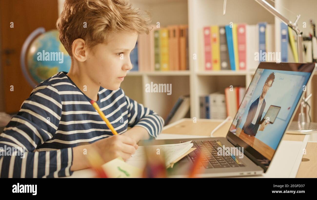 Smart Little Boy Uses Laptop for Video Call with His Teacher. Screen ...