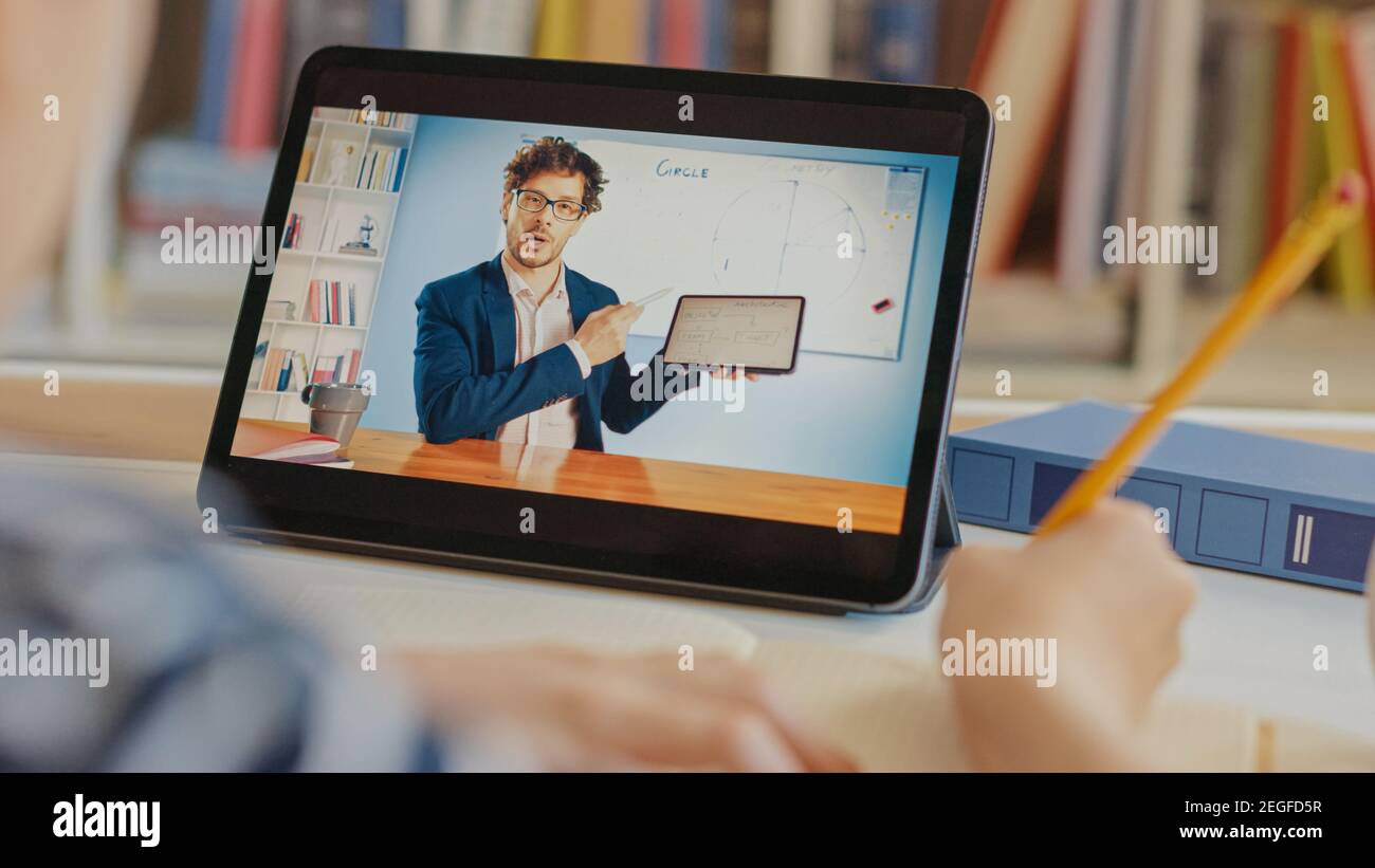 Little Boy Uses Digital Tablet for Video Call with His Teacher. Screen ...