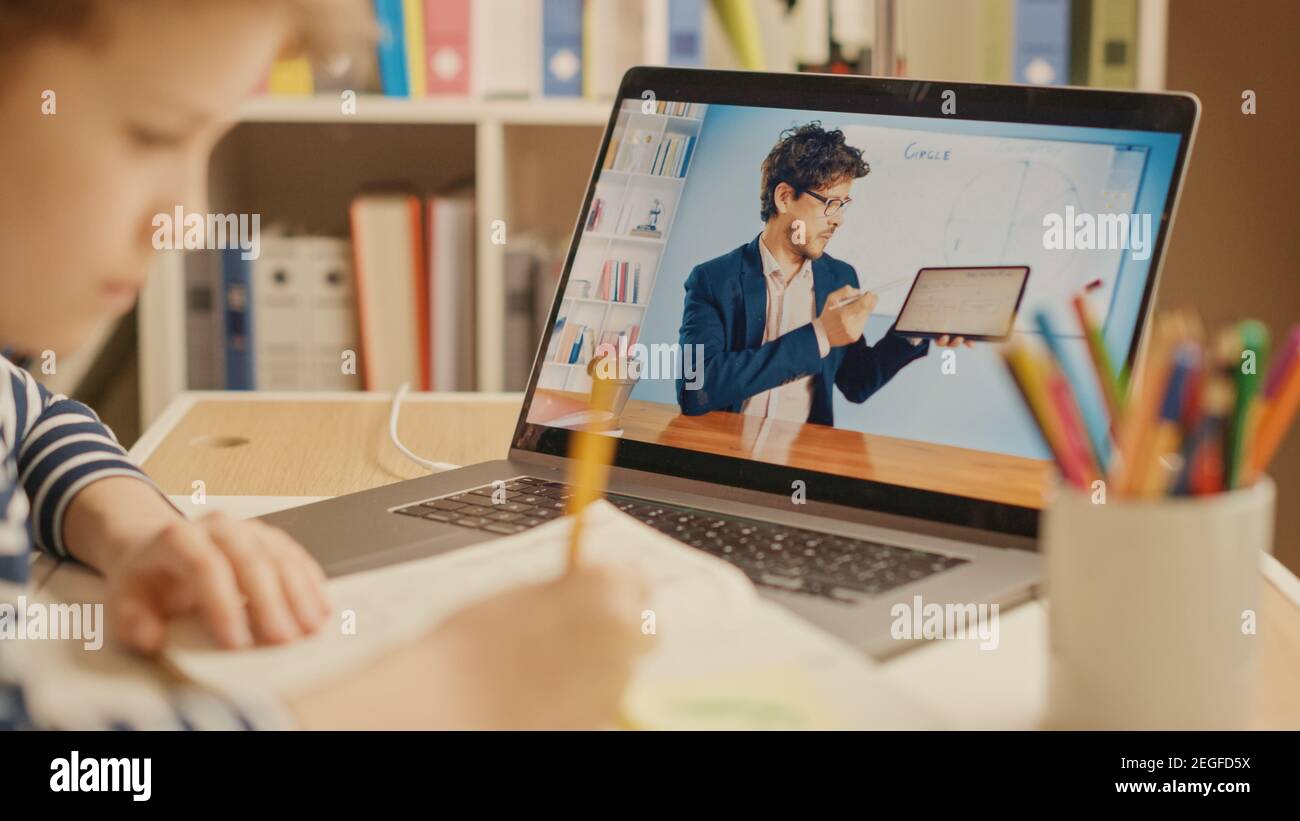 Smart Little Boy Uses Laptop for Video Call with His Teacher. Screen ...