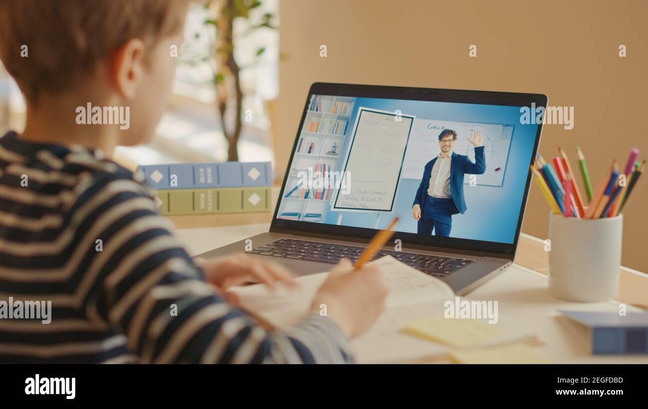 Smart Little Boy Uses Laptop for Video Call with His Teacher. Screen ...