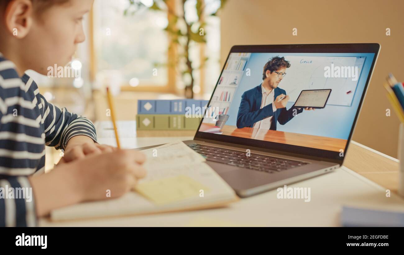 Smart Little Boy Uses Laptop for Video Call with His Teacher. Screen ...