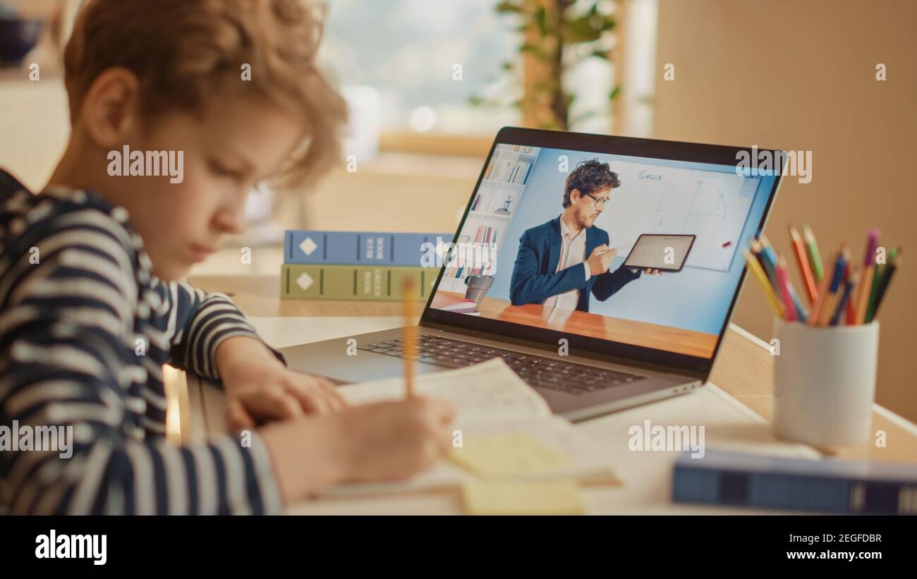 Smart Little Boy Uses Laptop for Video Call with His Teacher. Screen ...