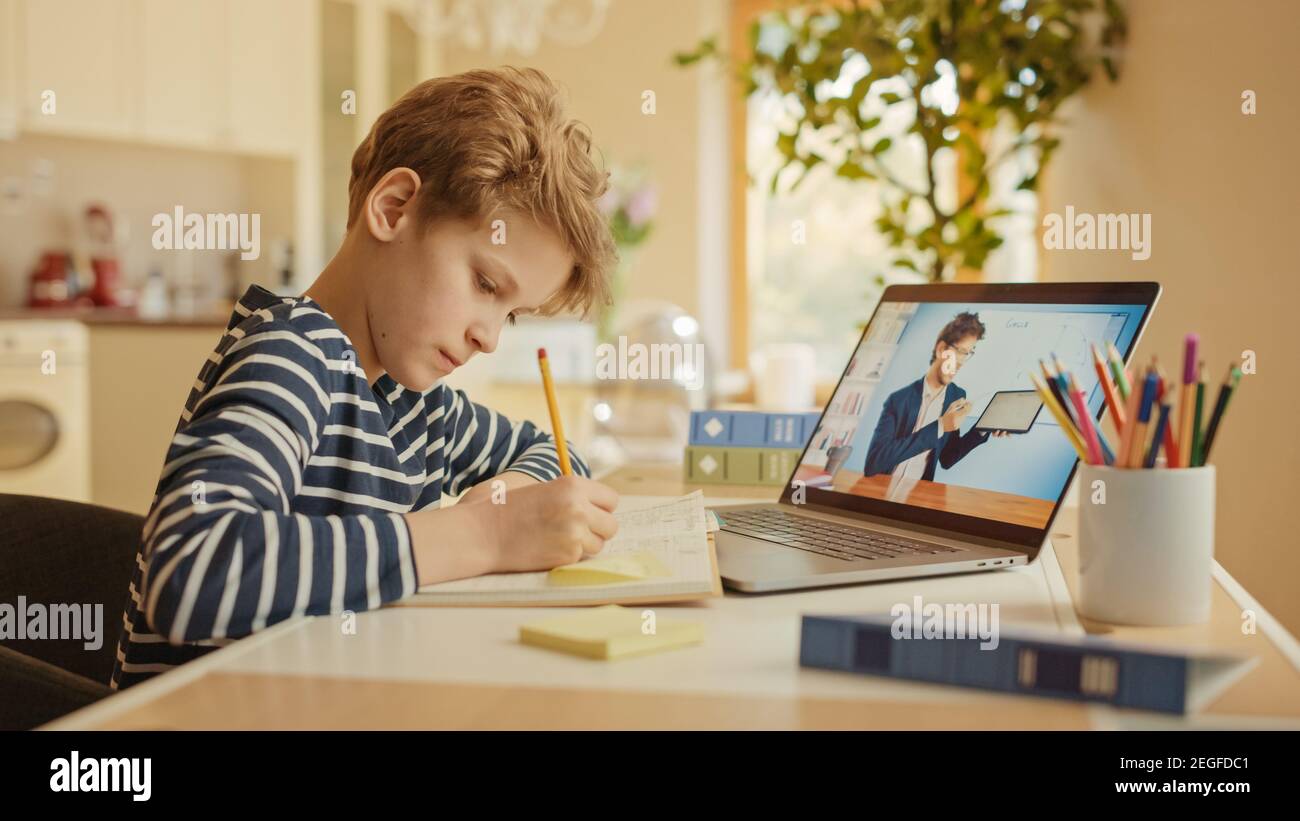 Smart Little Boy Uses Laptop for Video Call with His Teacher. Screen ...