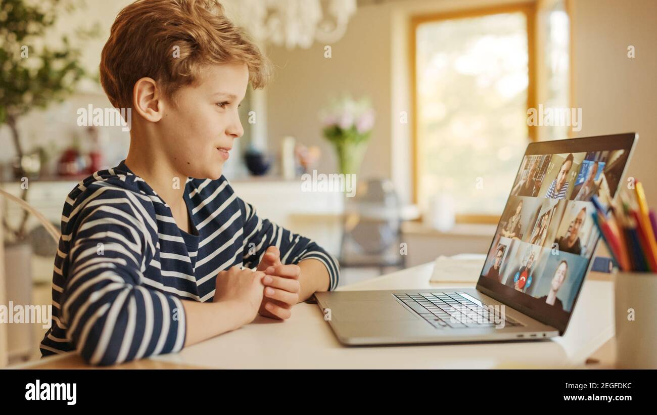 Cute Little Boy Uses Laptop with Conference Video Call Software to Talk ...