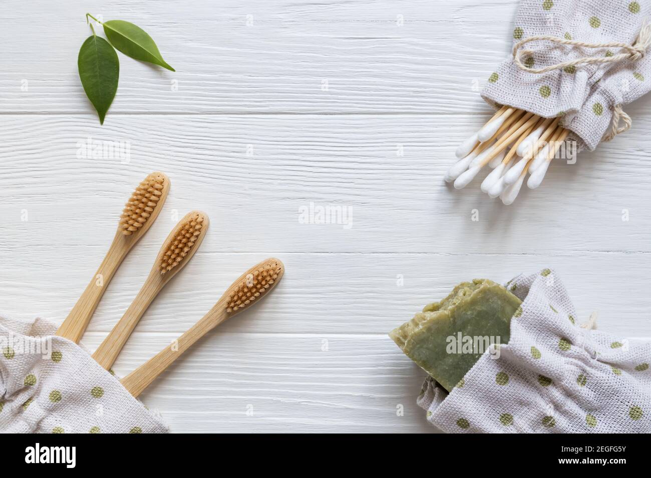 Eco-friendly personal care and home cleaning items on a white ...