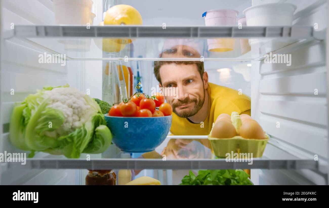 View from inside fridge man hi-res stock photography and images - Alamy