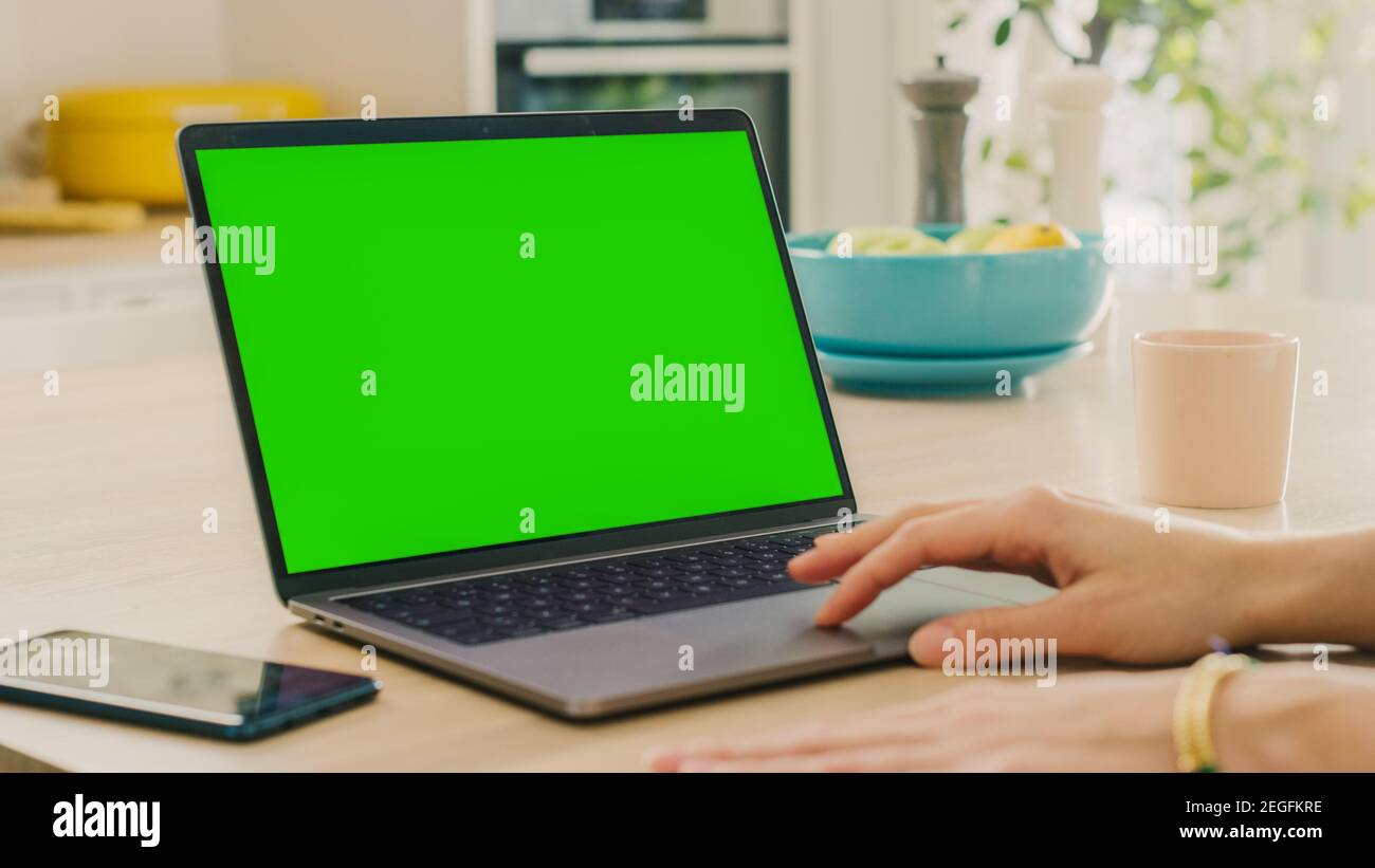 Close Up Green Screen Mock Up on a Laptop Computer. Device is Used on a ...
