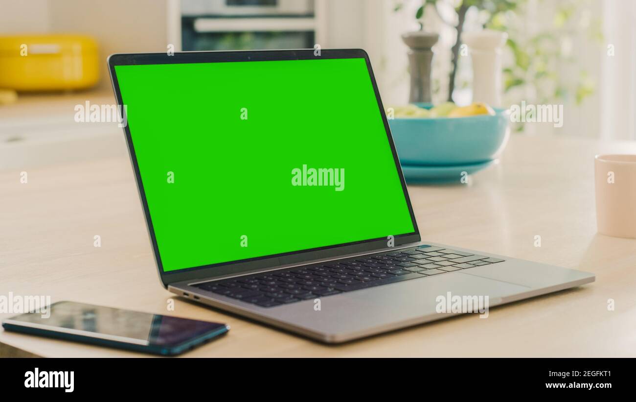 Close Up Green Screen Mock Up on a Laptop Computer. Device is Used on a ...