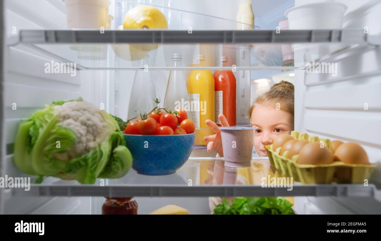 Cute Little Girl Opens Fridge Door, Looks inside Takes out Healthy ...
