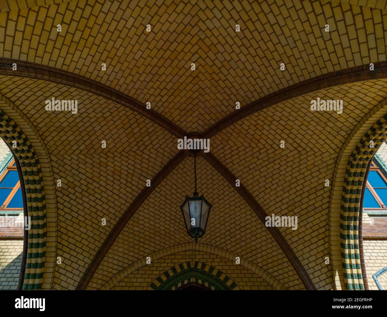 Old brick dome with hanging lamp in front of entrance to building Stock ...