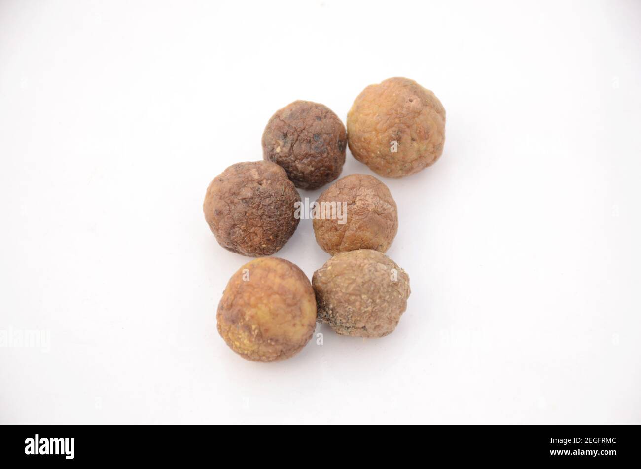 Closeup of a group of dried gooseberries isolated on white background ...