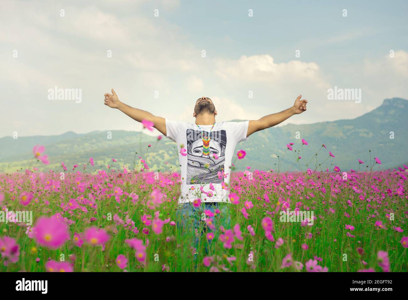 Male celebrating freedom in a field o Stock Photo - Alamy