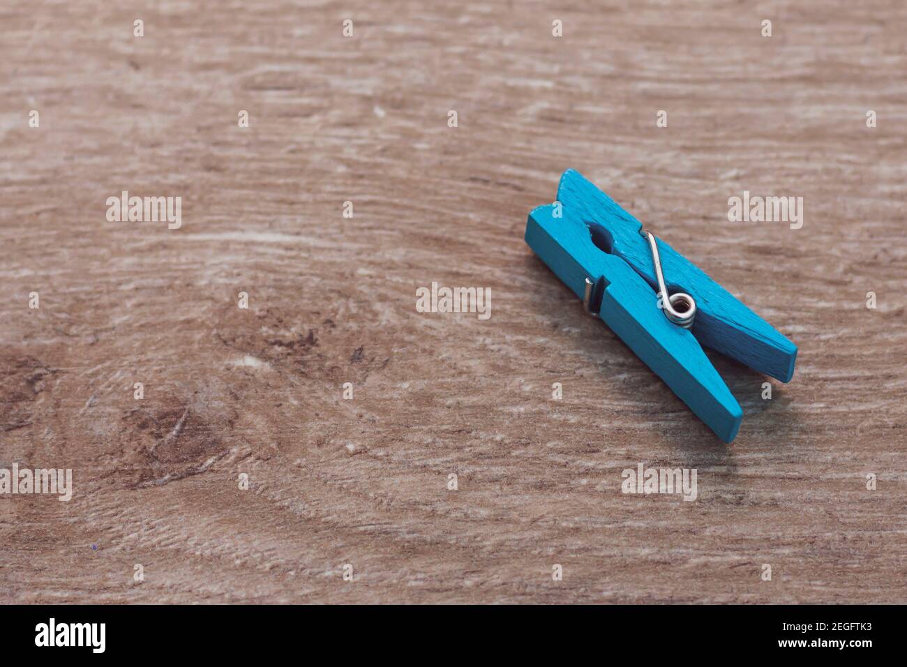 Wood paper clip on wooden background Stock Photo - Alamy