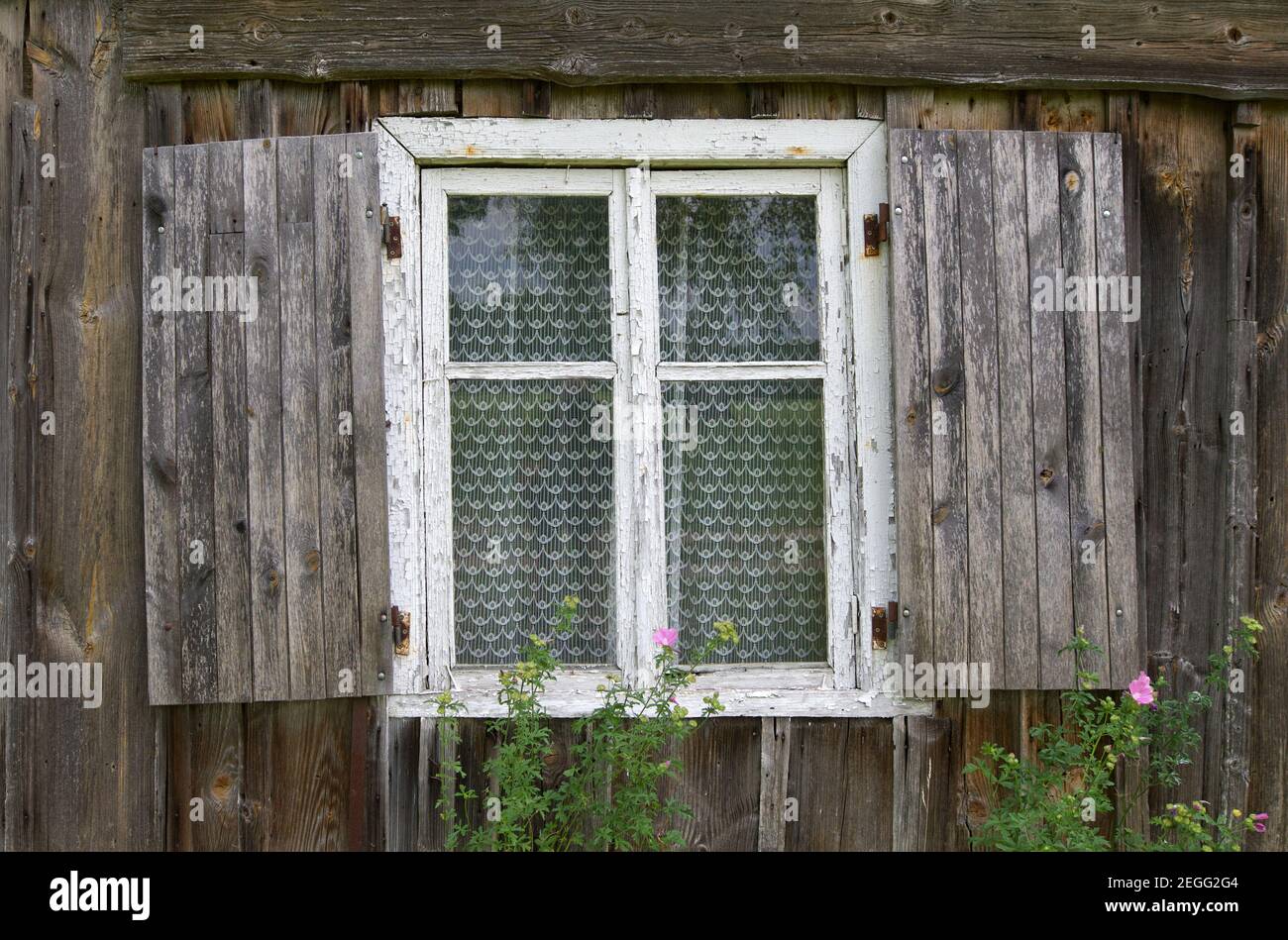 An old window on a wooden house facade Stock Photo - Alamy