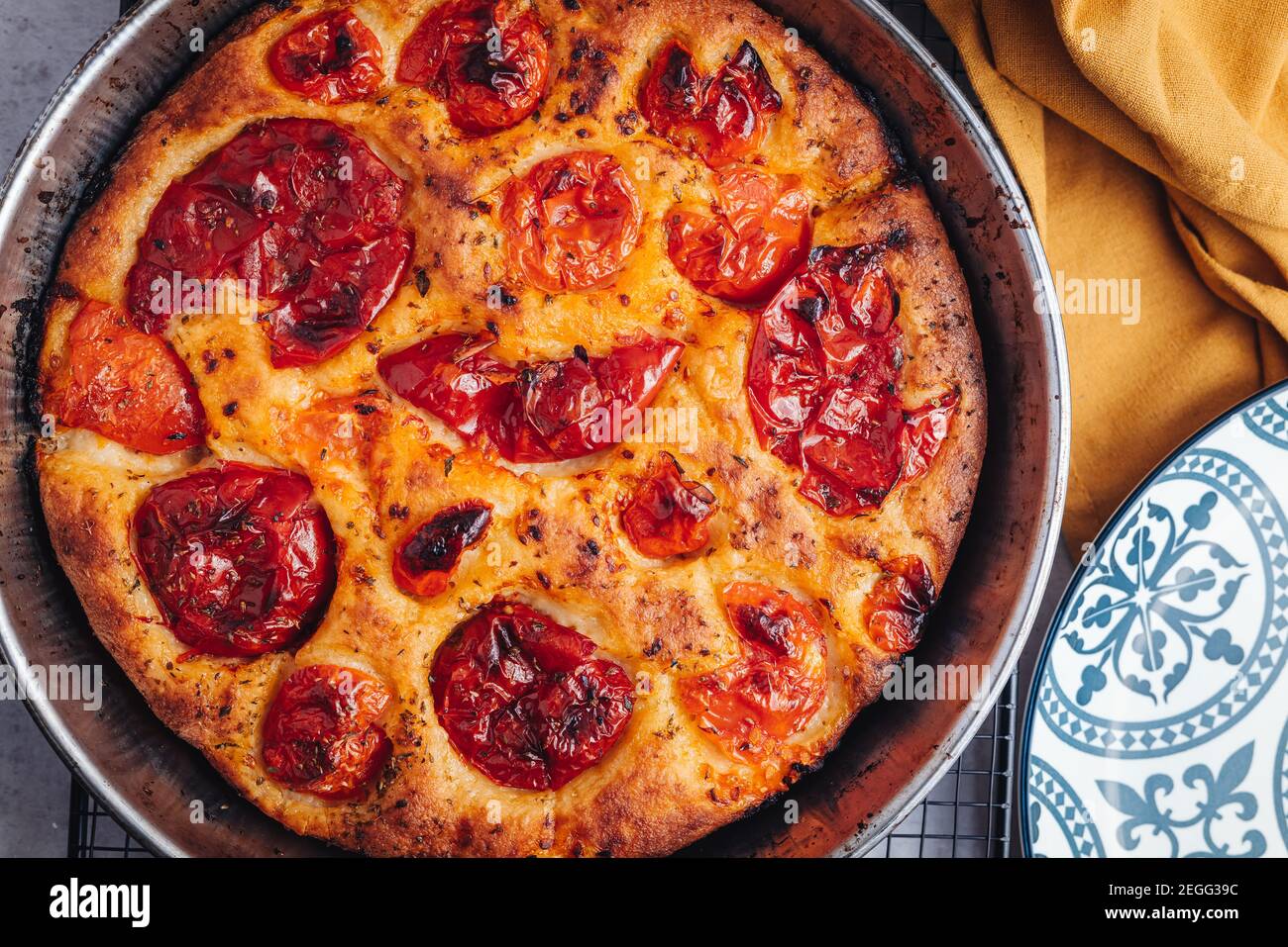 Delicious traditional focaccia bread with fresh tomatoes and olive oil ...