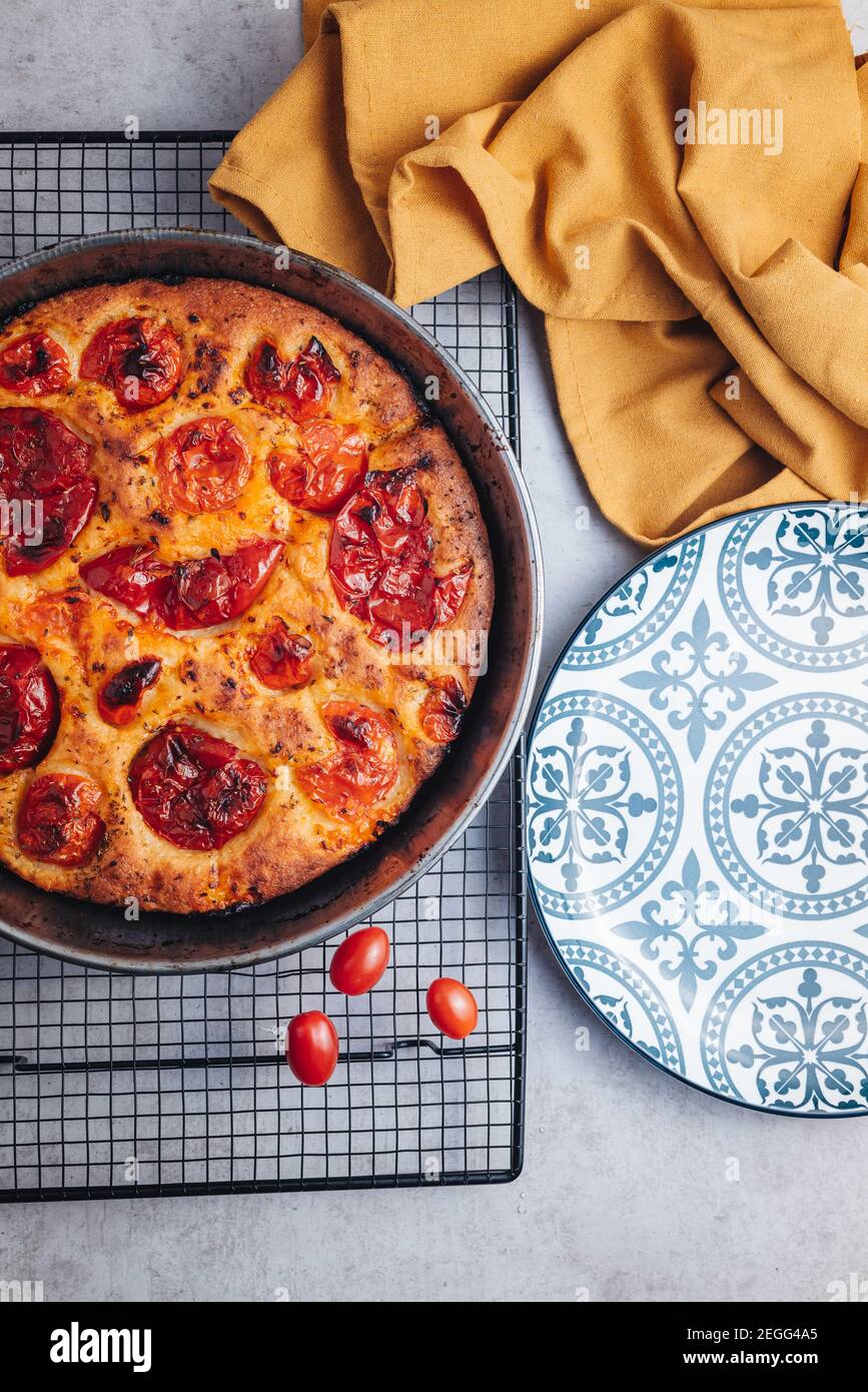 Delicious traditional focaccia bread with fresh tomatoes and olive oil ...