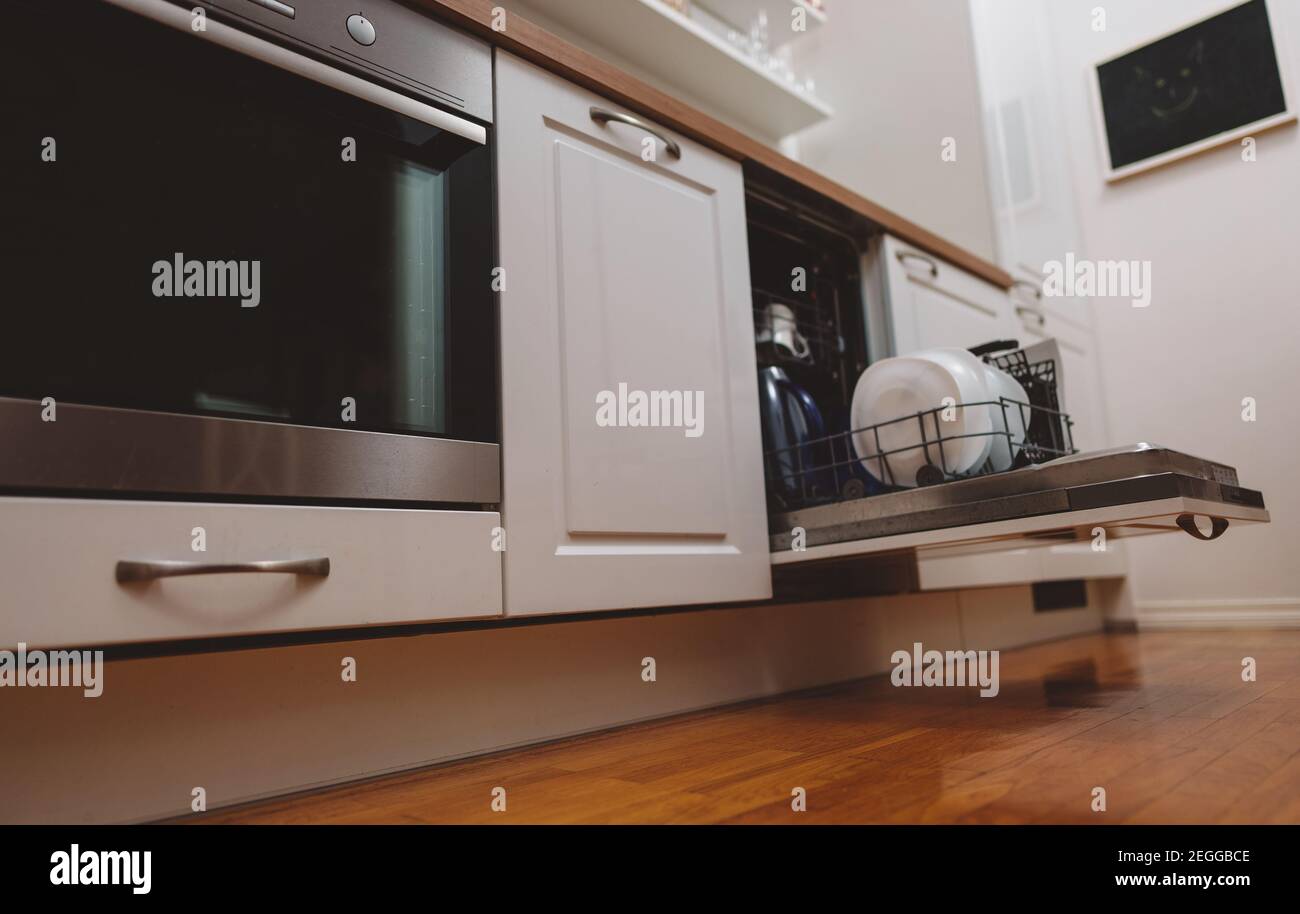 Open dishwasher with washed dishes in the kitchen Stock Photo - Alamy