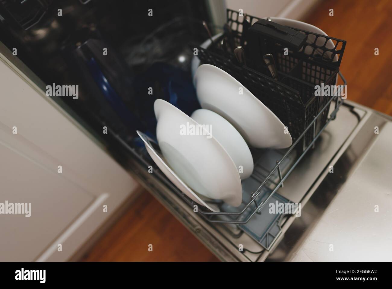 Open dishwasher with washed dishes in the kitchen Stock Photo - Alamy