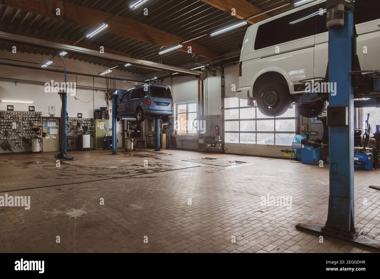 in a car workshop there are lifting platforms for repairing cars Stock ...