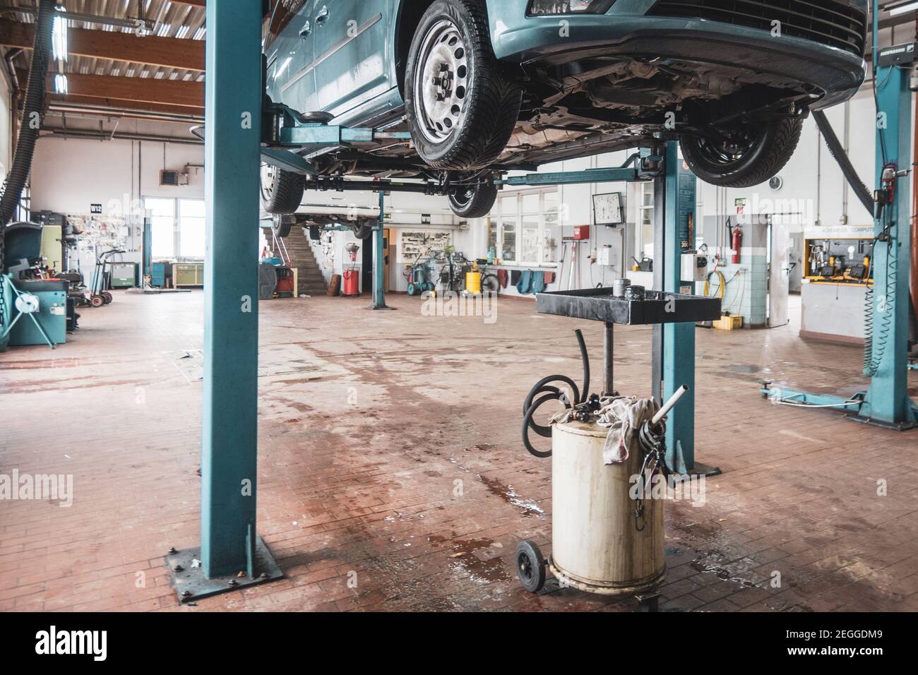 in a car workshop there are lifting platforms for repairing cars Stock ...