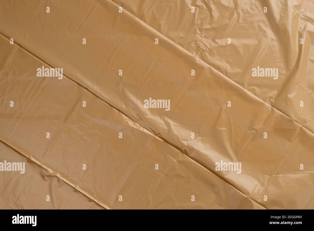 Folded plastic wrinkled recycled garbage bag with wrinkles. Abstract ...