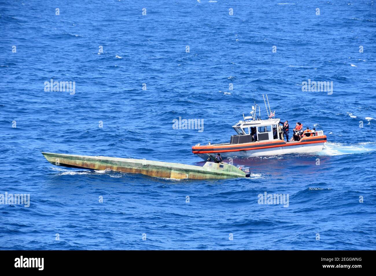 A U.S. Coast Guard boarding crew member from the Cutter Bertholf ...