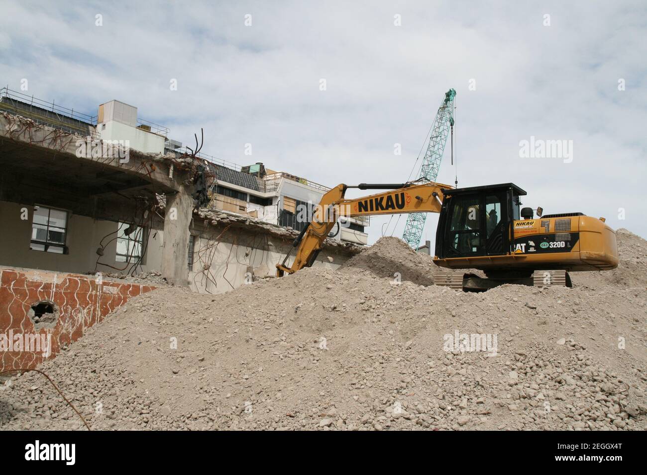 Excavator at site, post earthquake construction and demolition ...