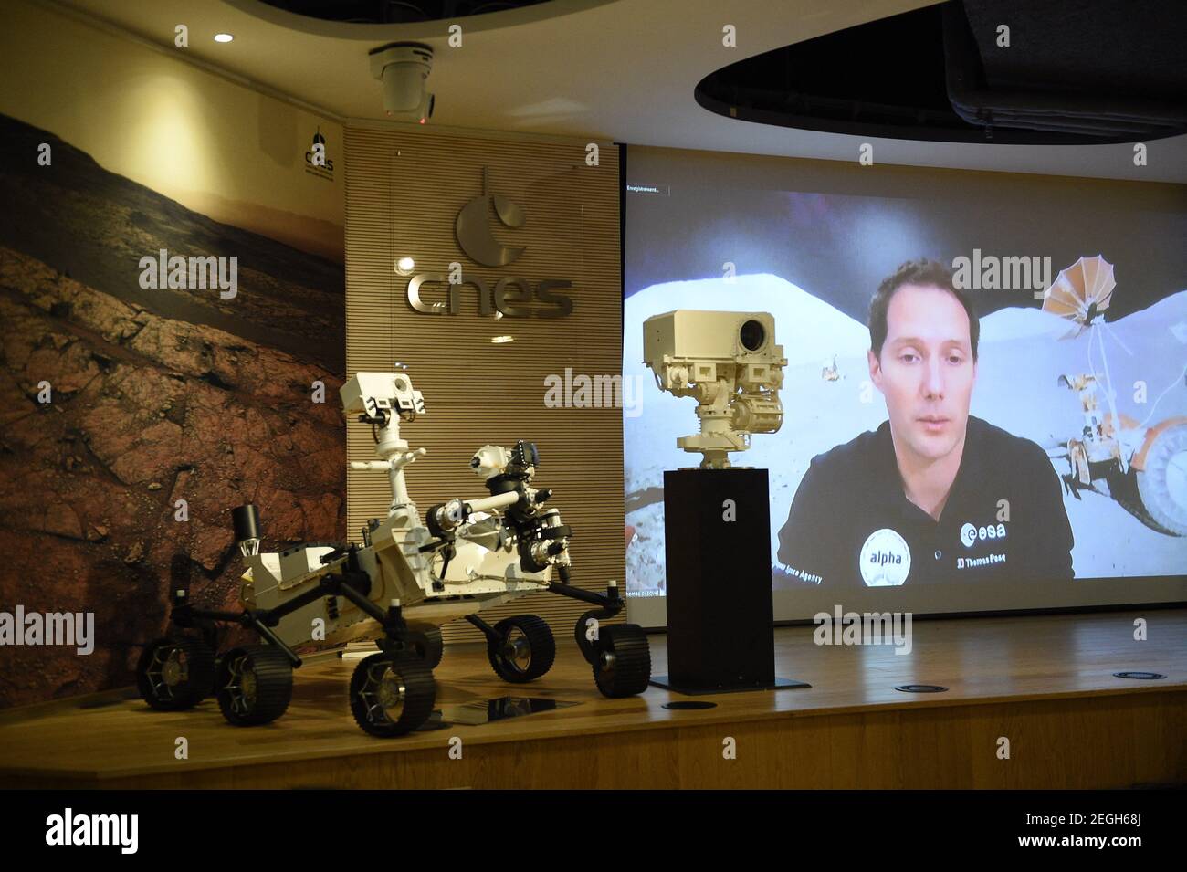French astronaut Thomas Pesquet appears on a screen to deliver a speech ...