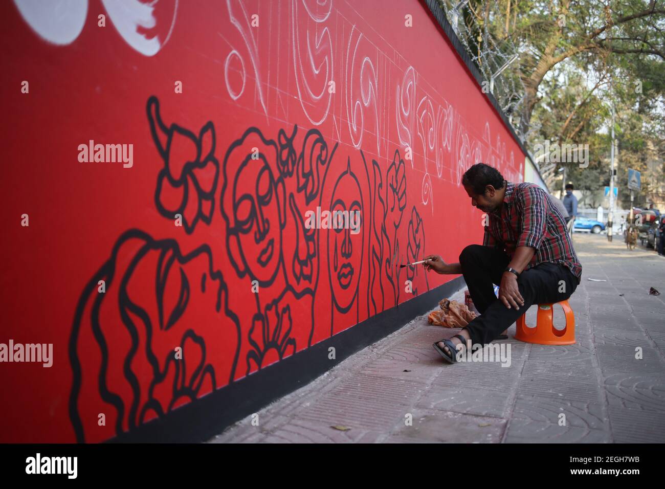 Dhaka, Bangladesh. 18th Feb, 2021. Artists are painting the walls with ...