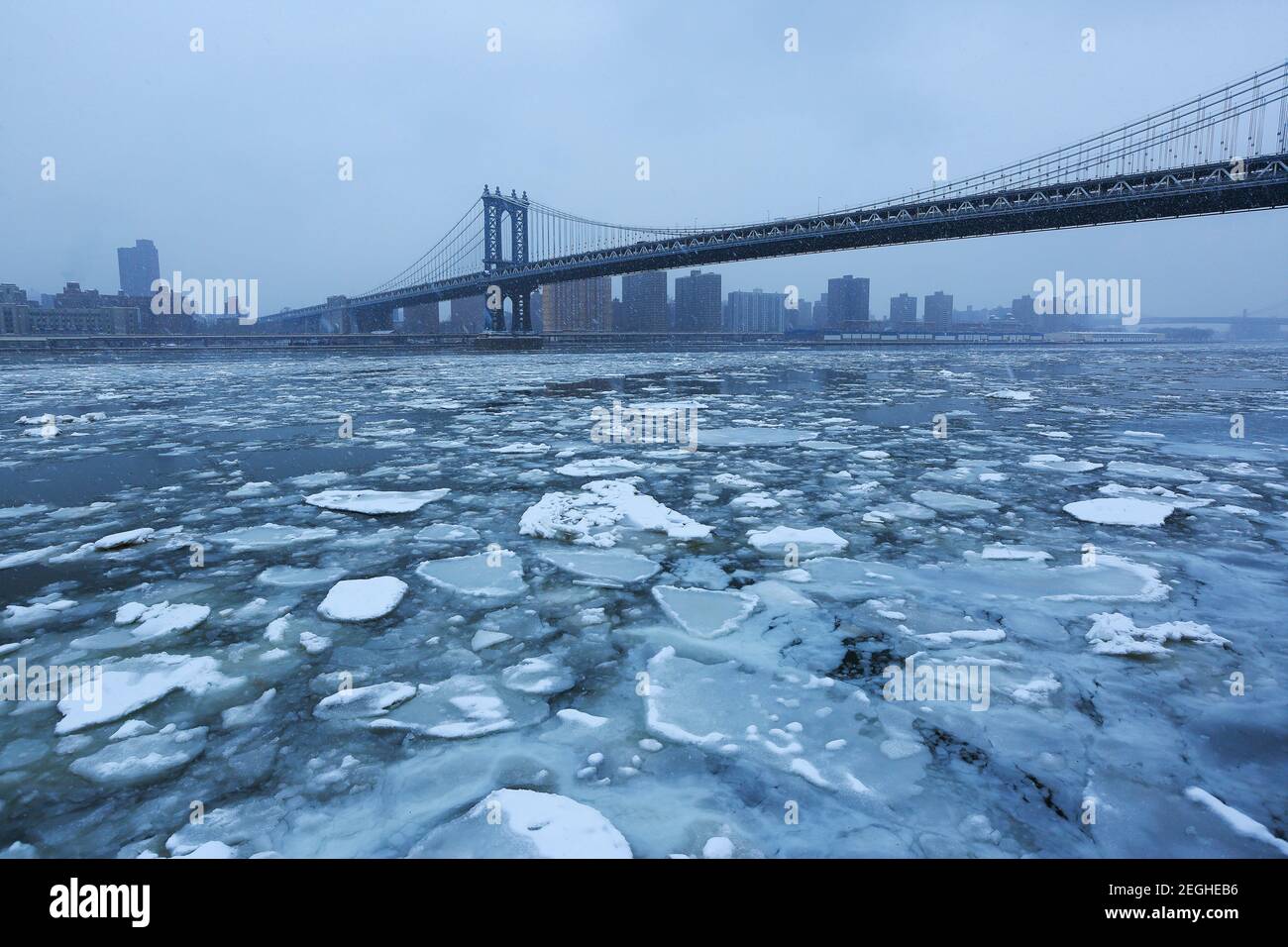 Frozen ice chunks float and drift in the East River due to the cold ...
