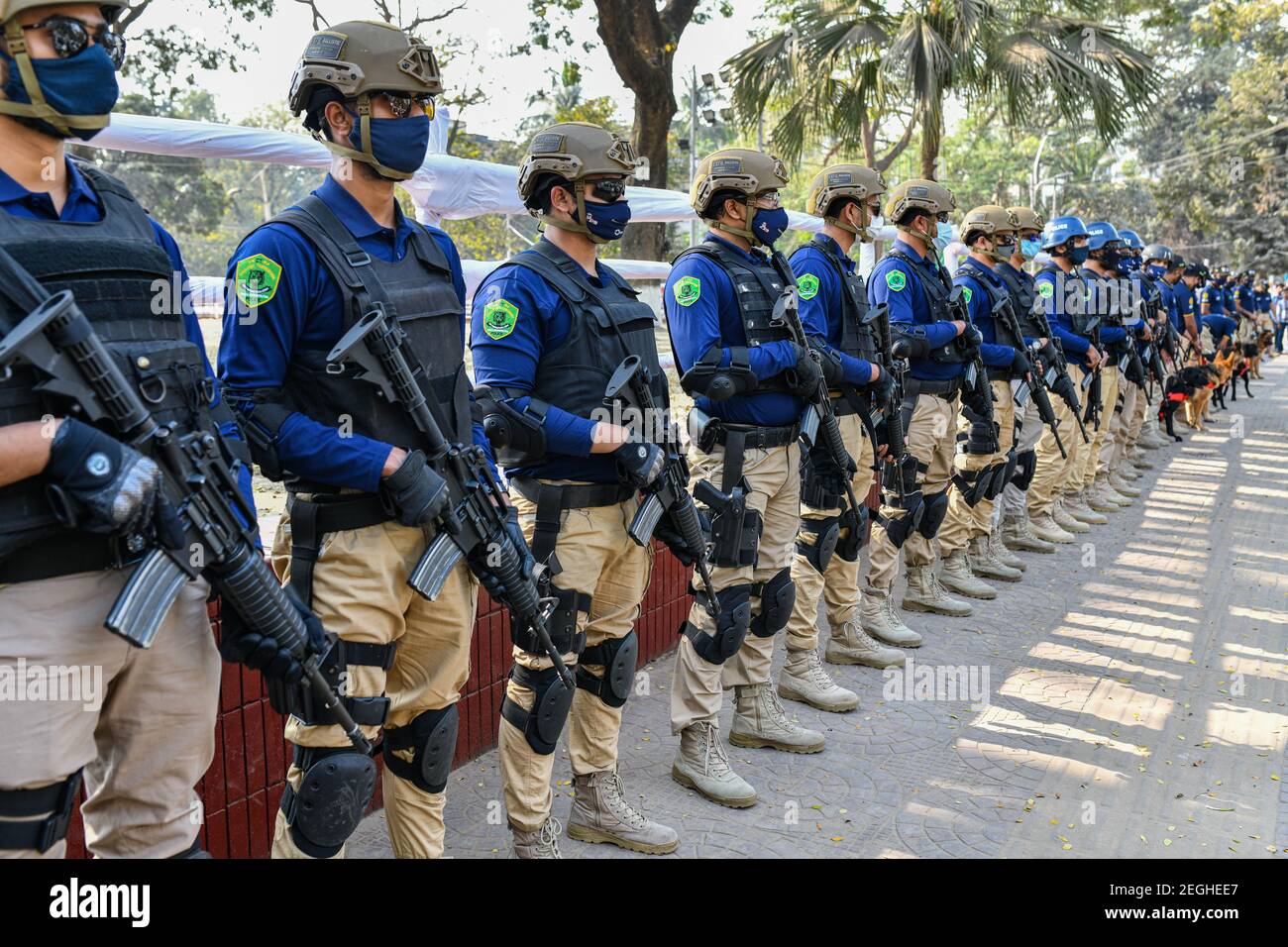 SWAT officials are standing in front of Central Shaheed Minar in the ...