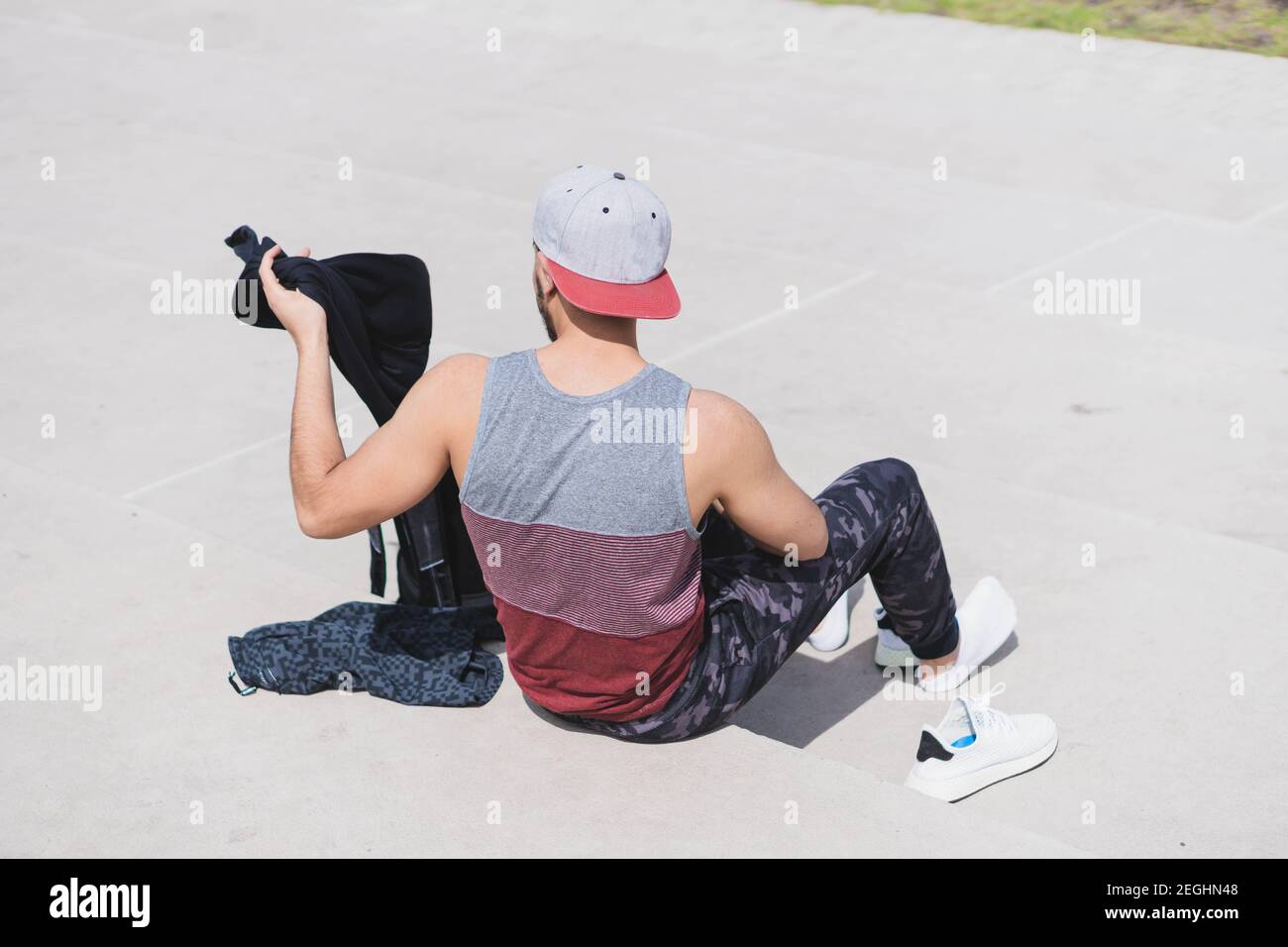 Backpack with clothes and accessories to do sports anywhere Stock Photo ...