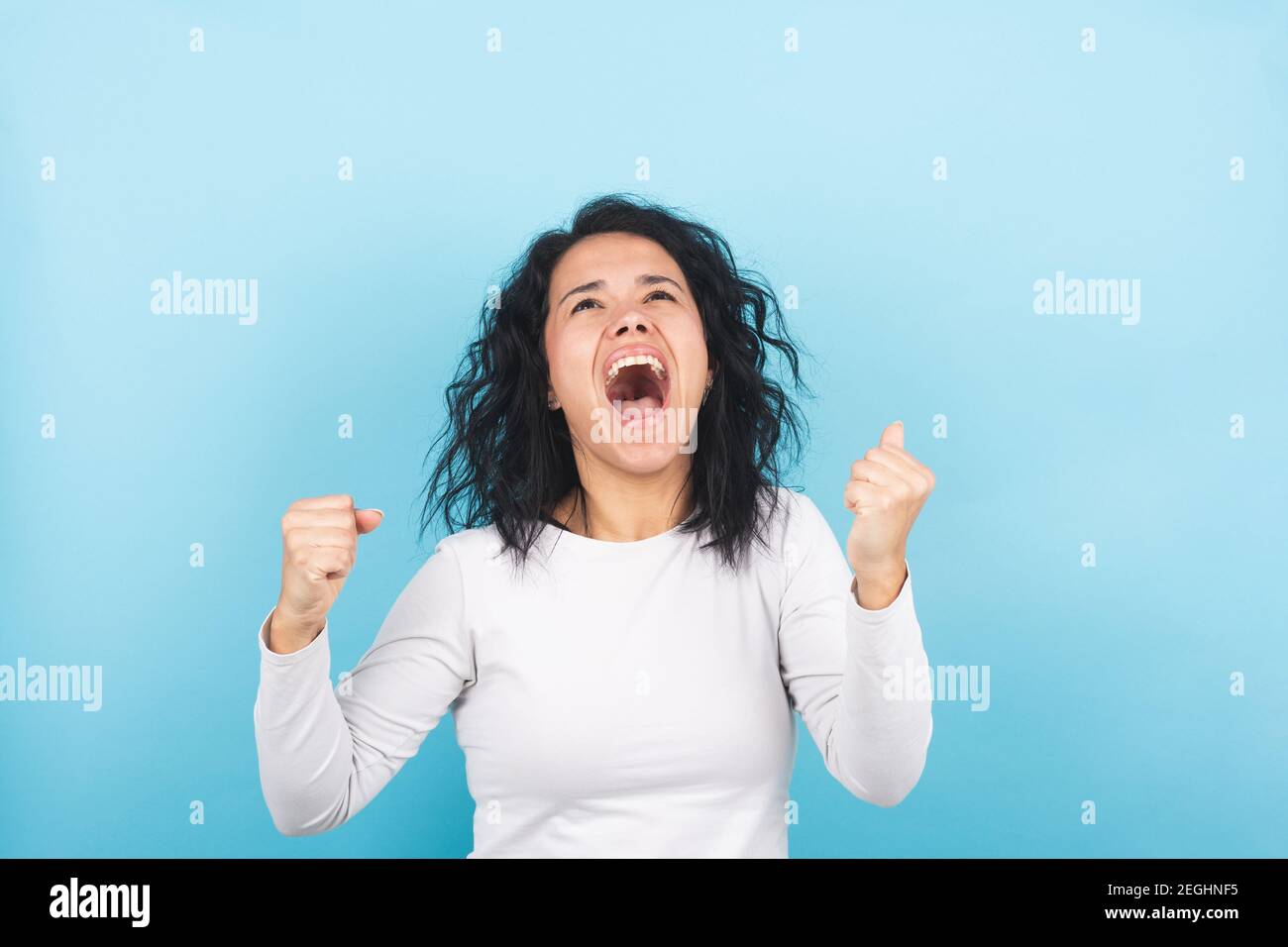 Young brunette woman makes an effusive gesture of celebration Stock ...