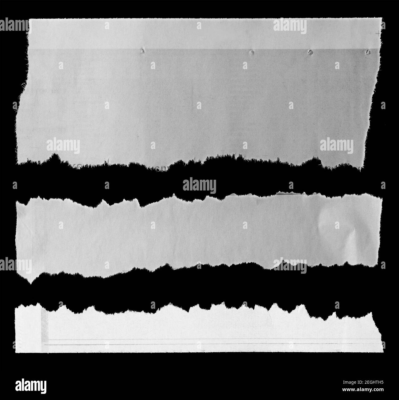 Three pieces of torn newspaper on black background Stock Photo - Alamy