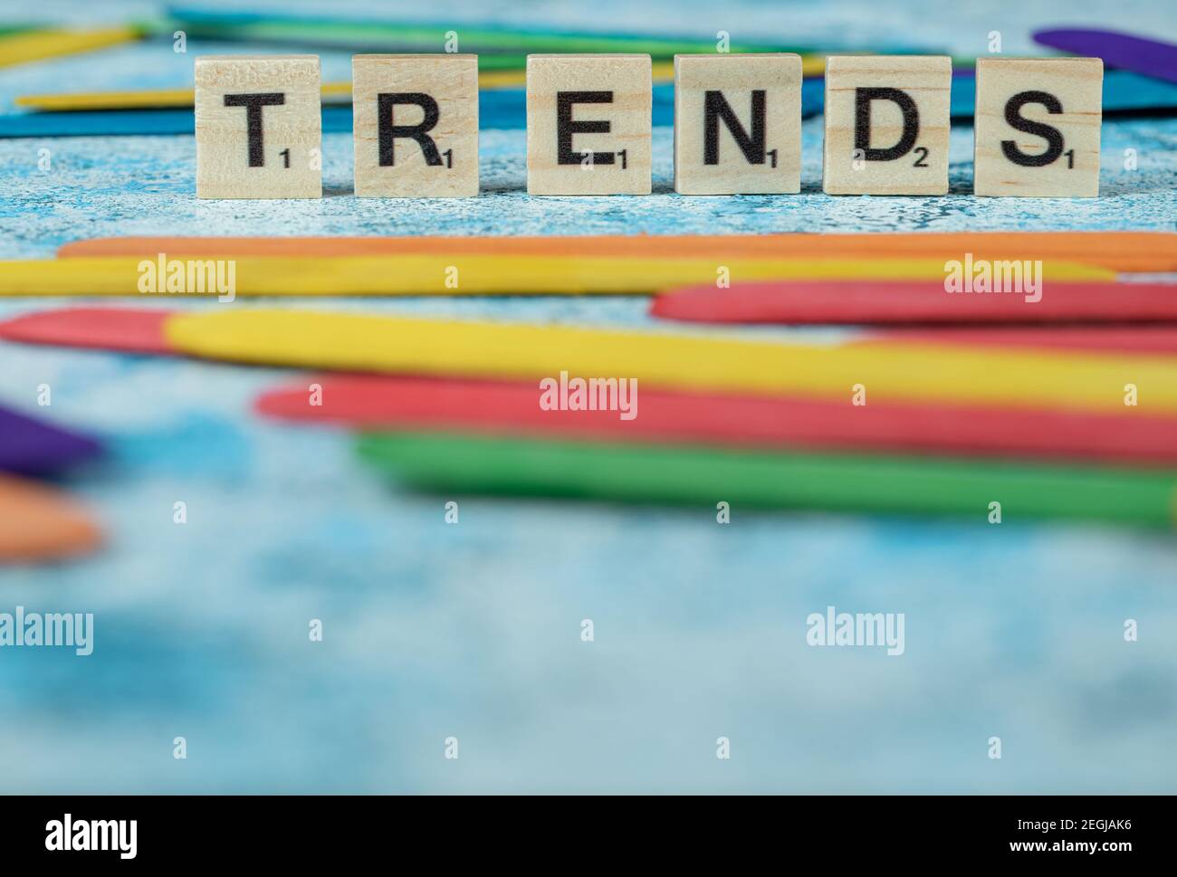 Trends writing with black letters on wooden dices on the blue ...