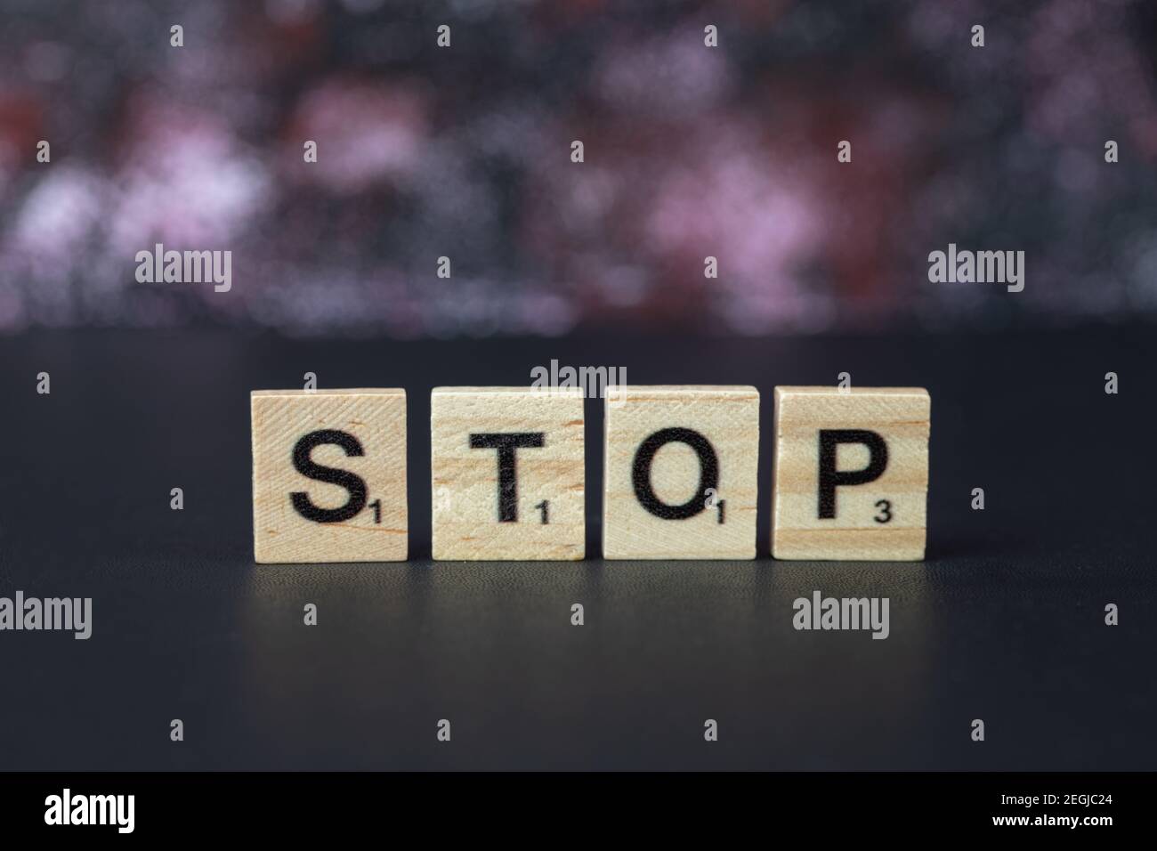 Stop symbolic writing with black letters on wooden dices in horizontal ...