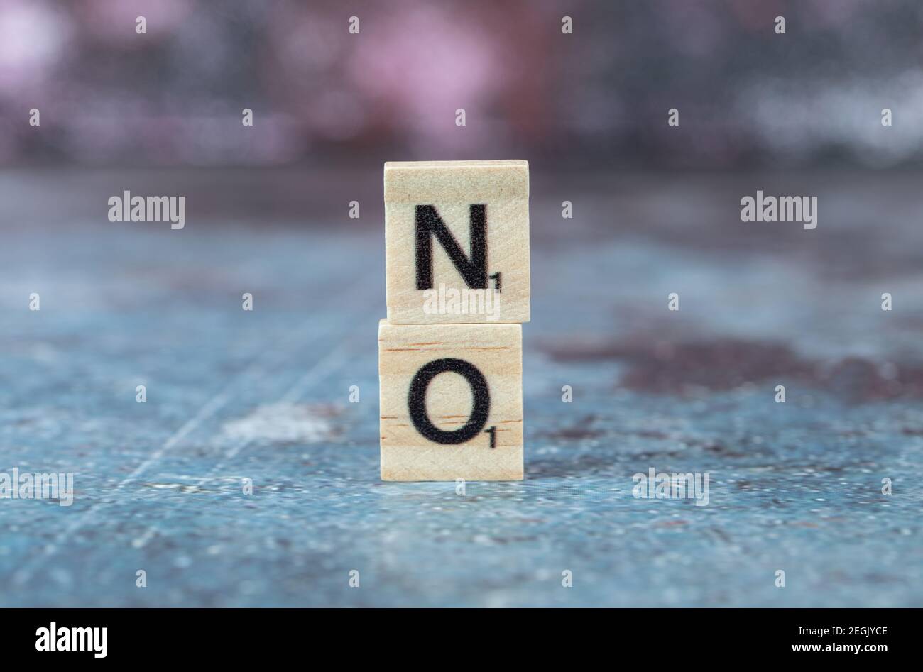 No symbolic writing with black letters on wooden dices in vertical ...