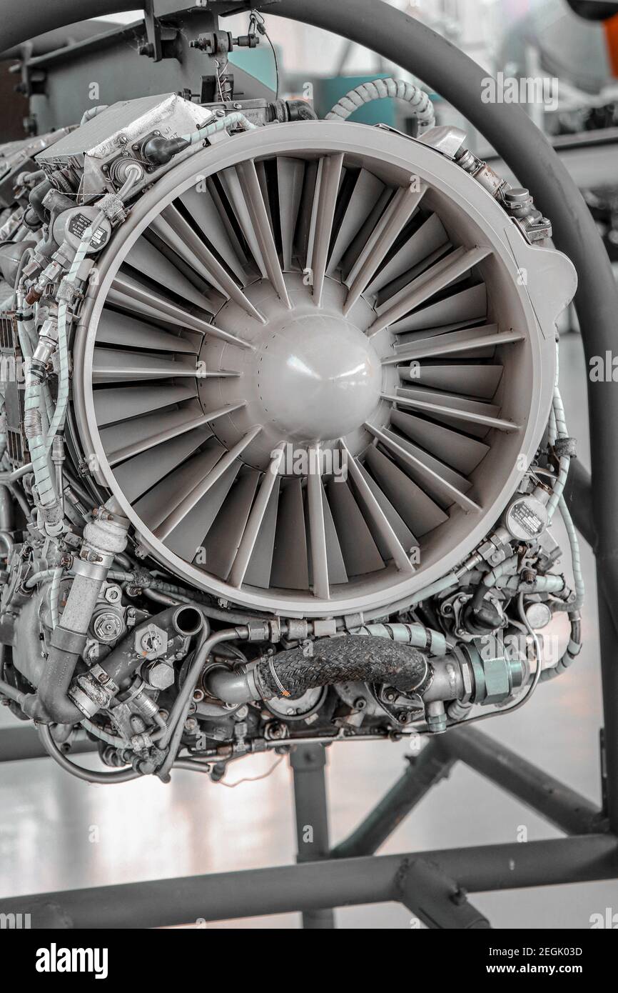 assembling an engine on a passenger jet at a hangar Stock Photo - Alamy