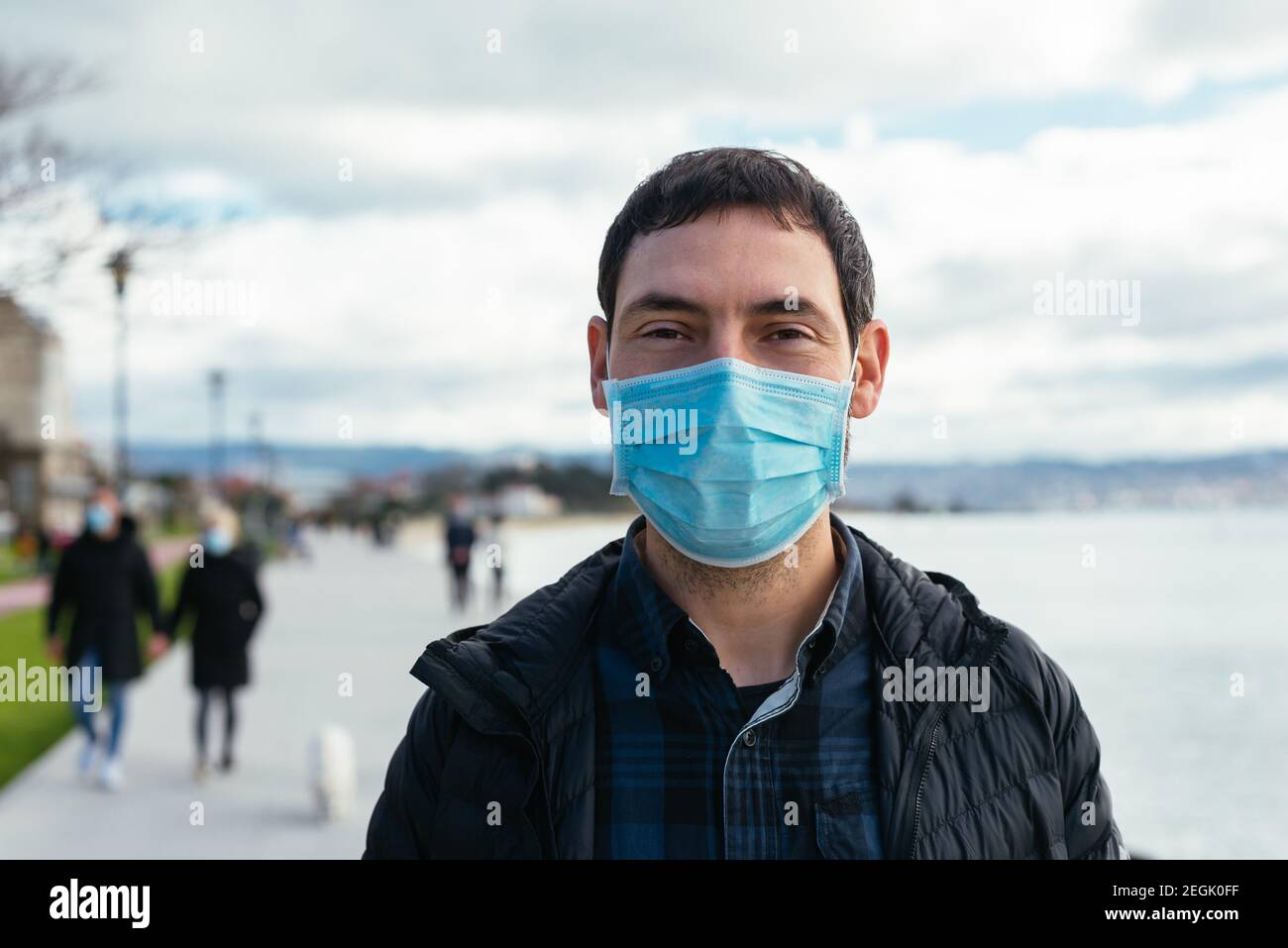 Portrait of a young man on the street wearing a face mask Stock Photo ...