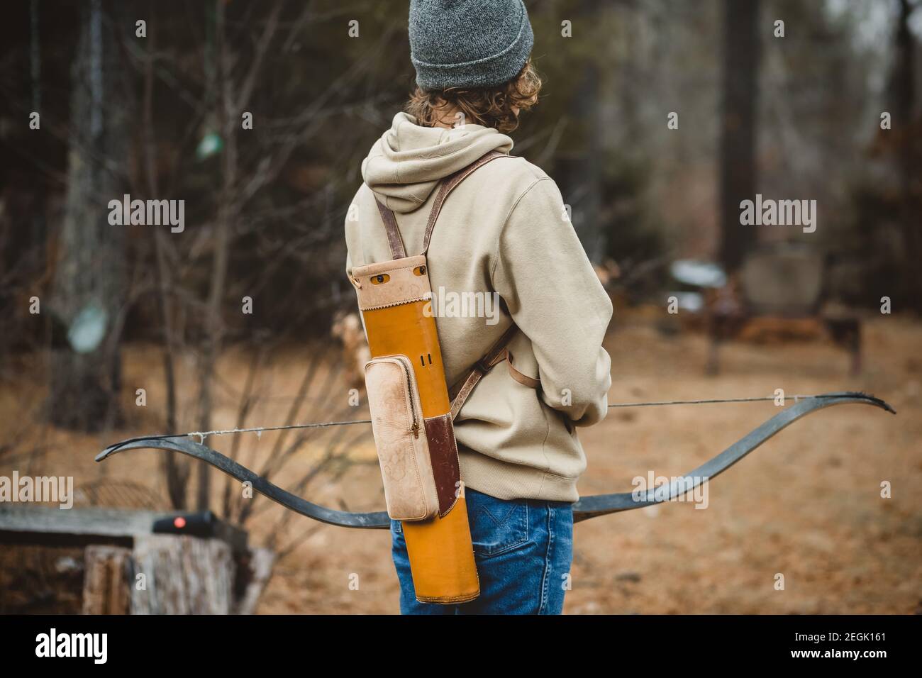 Teen boy with vintage quiver holding long bow in Wisconsin Stock Photo ...
