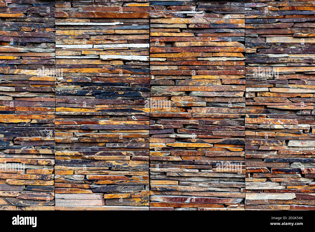 Rough stone bricks, in various colors and sizes are used to create ...