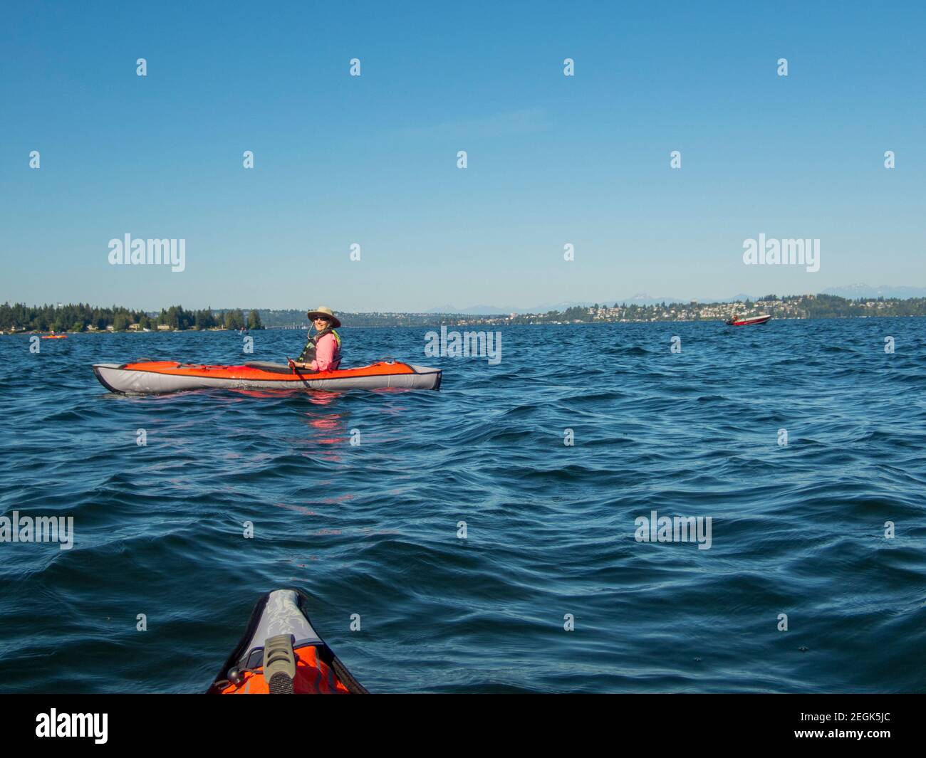 A kayaker (model released) is kayaking on Lake Washington near Kirkland ...