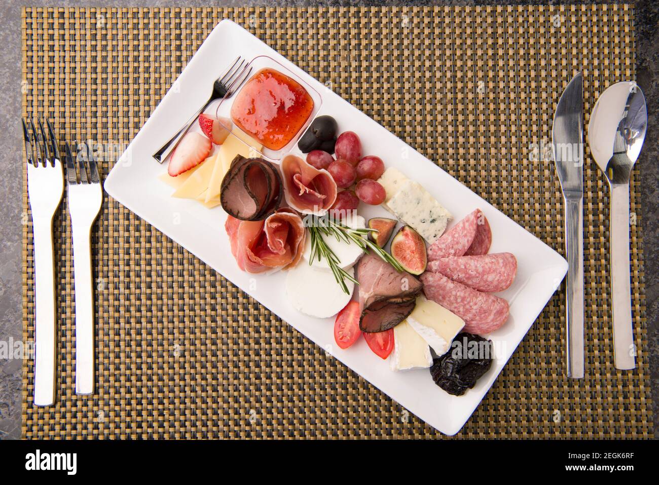 Fancy cold meat snack plate with berries and cheese Stock Photo - Alamy