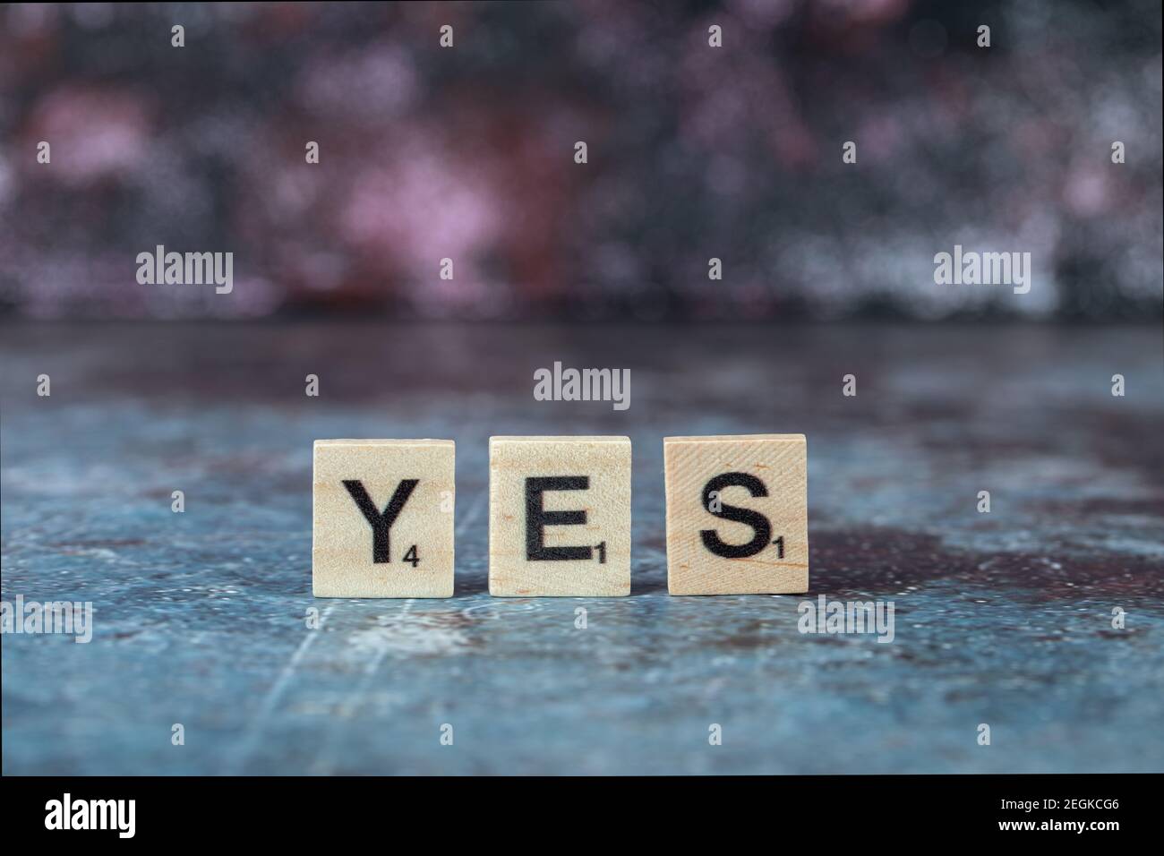 Yes symbolic writing with black letters on wooden dices in horizontal ...
